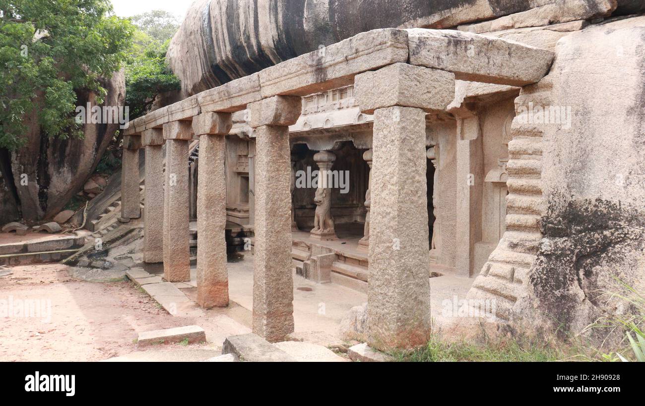 Cave stone hall carved in the rock with pillars in the cave background ...