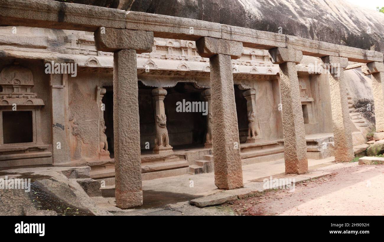 Cave stone hall carved in the rock with pillars in the cave background ...