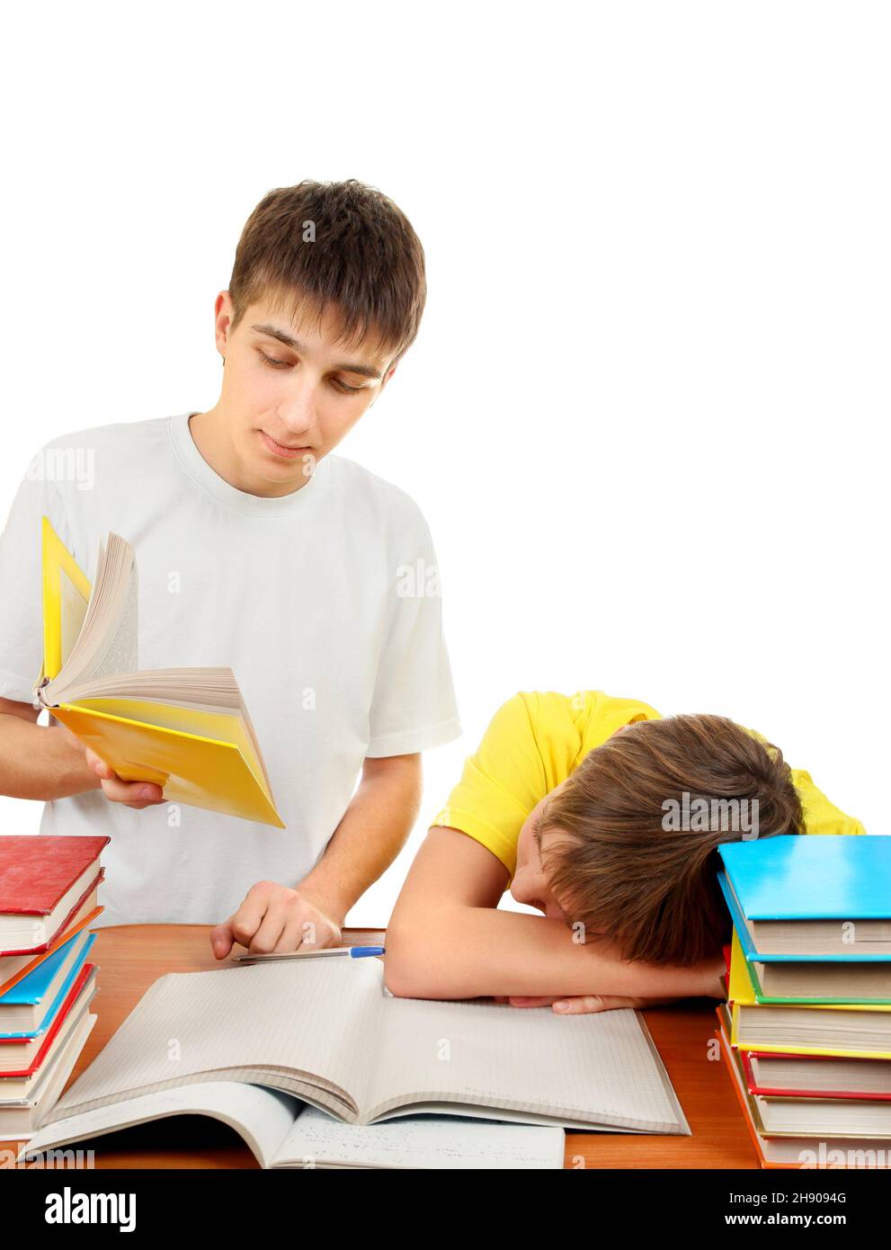 Older Brother and Bored Little Brother doing Homework on the White ...