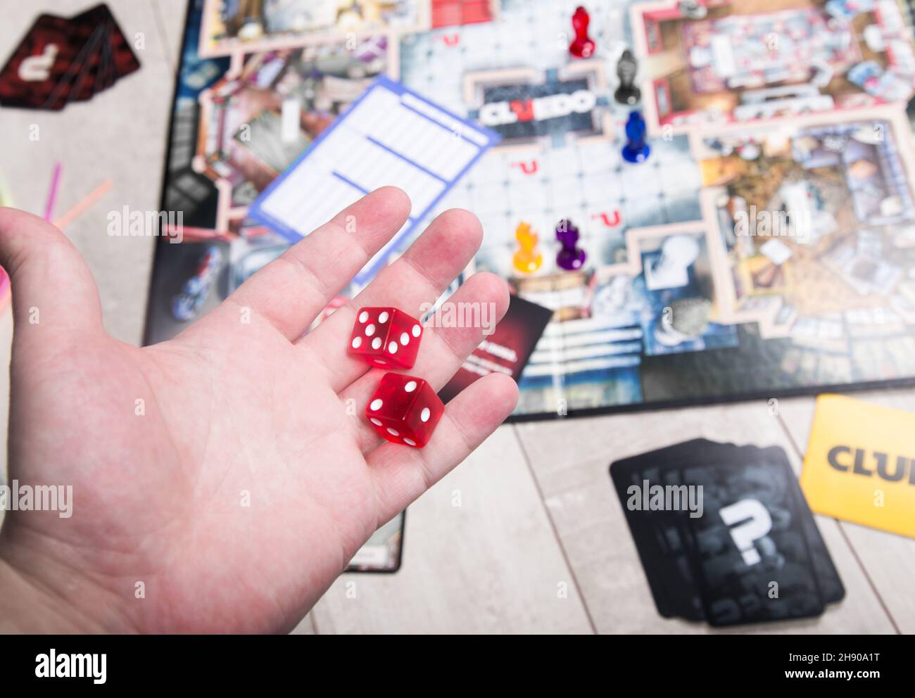 Moscow, Russia - March 24, 2015: Playing board game Cluedo with dices ...
