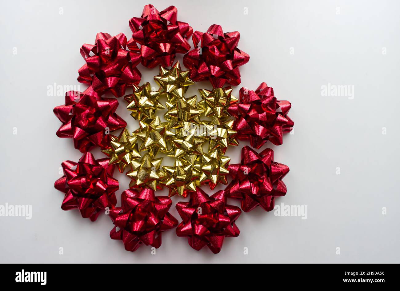 Christmas gift wrapping bows. Large glossy red and golden bows Stock ...