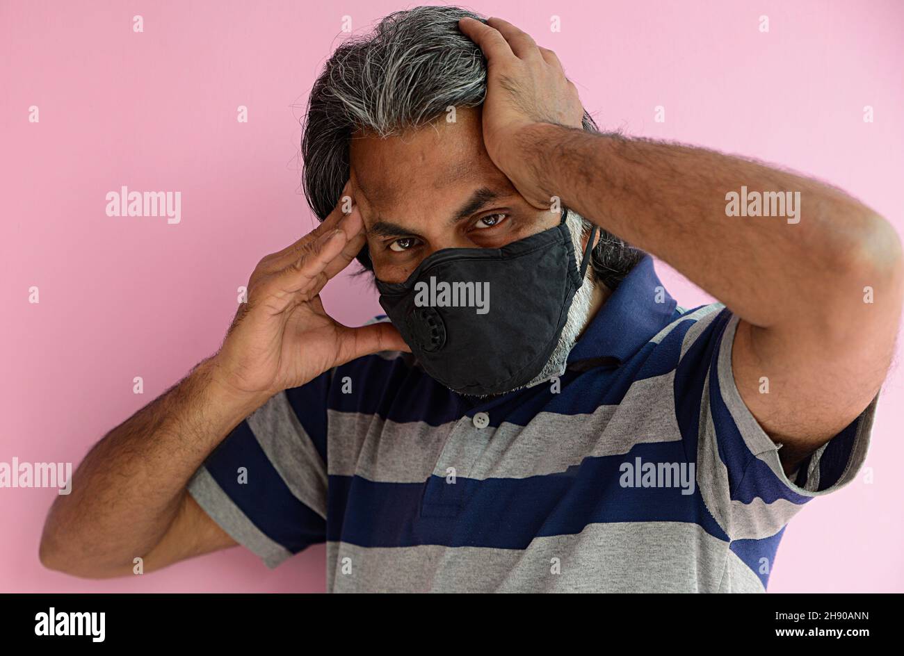 Corona virus infected Man wearing protective mask showing symptoms of ...