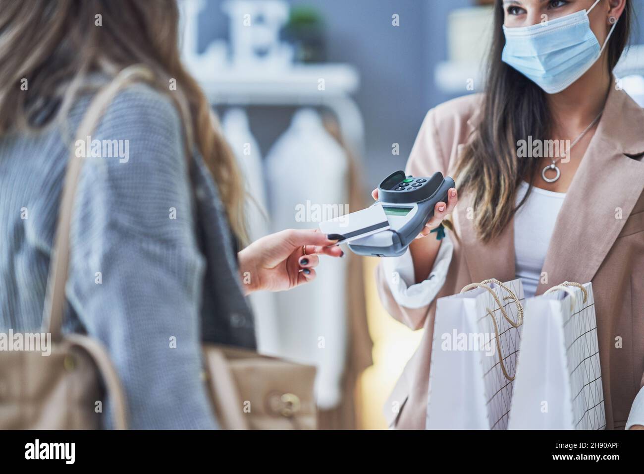 Woman shop clothes checkout hi-res stock photography and images - Alamy