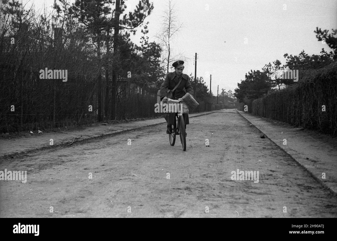Postman on his bicycle Black and White Stock Photos & Images - Alamy
