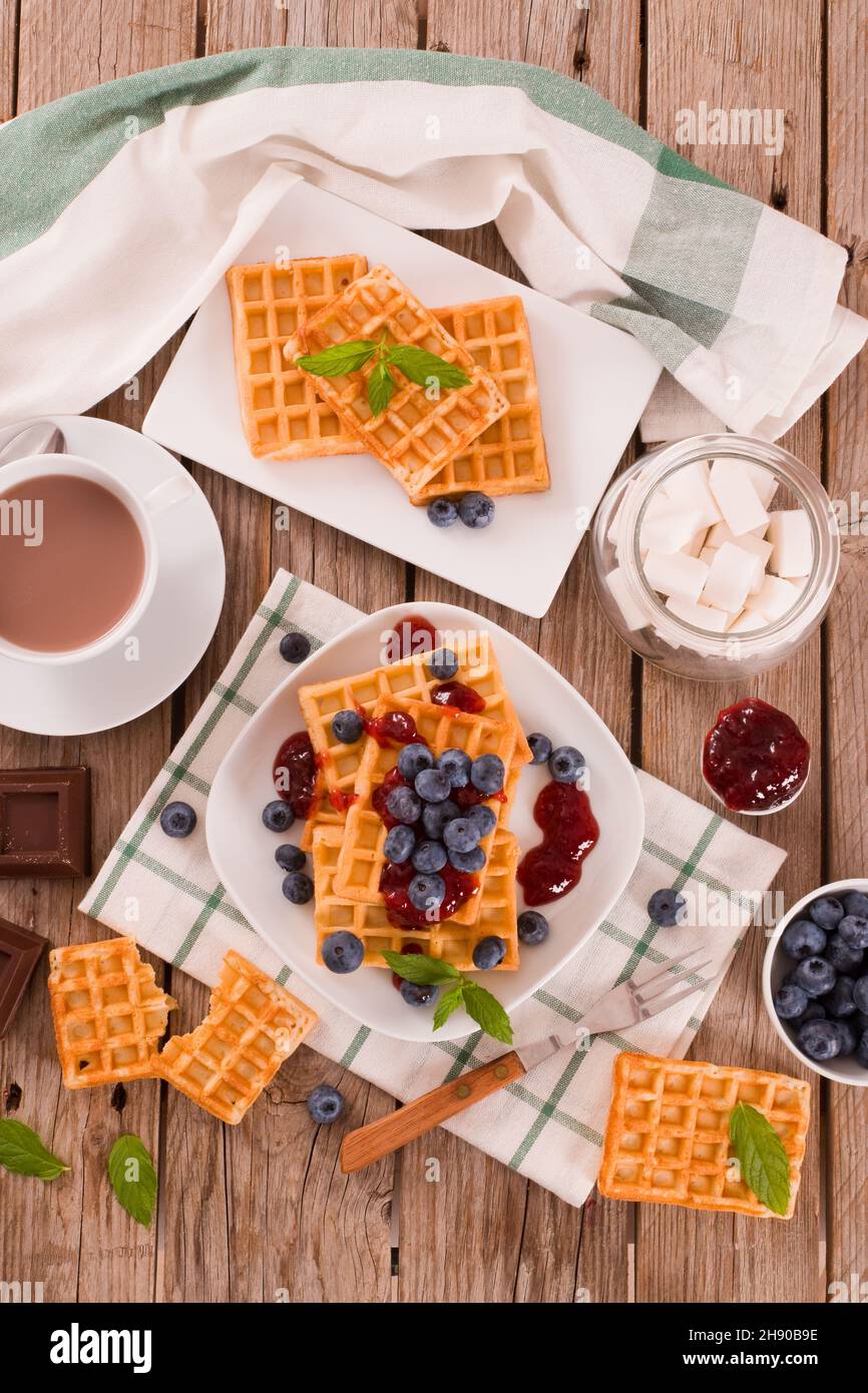 Waffles with blueberries and jam Stock Photo - Alamy