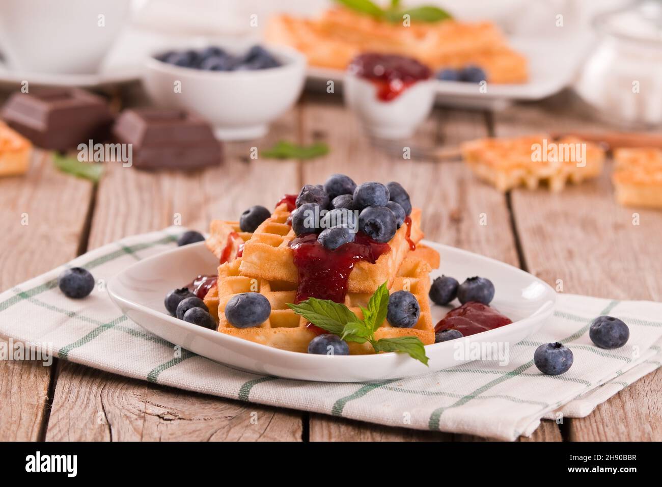 Waffles with blueberries and jam Stock Photo - Alamy