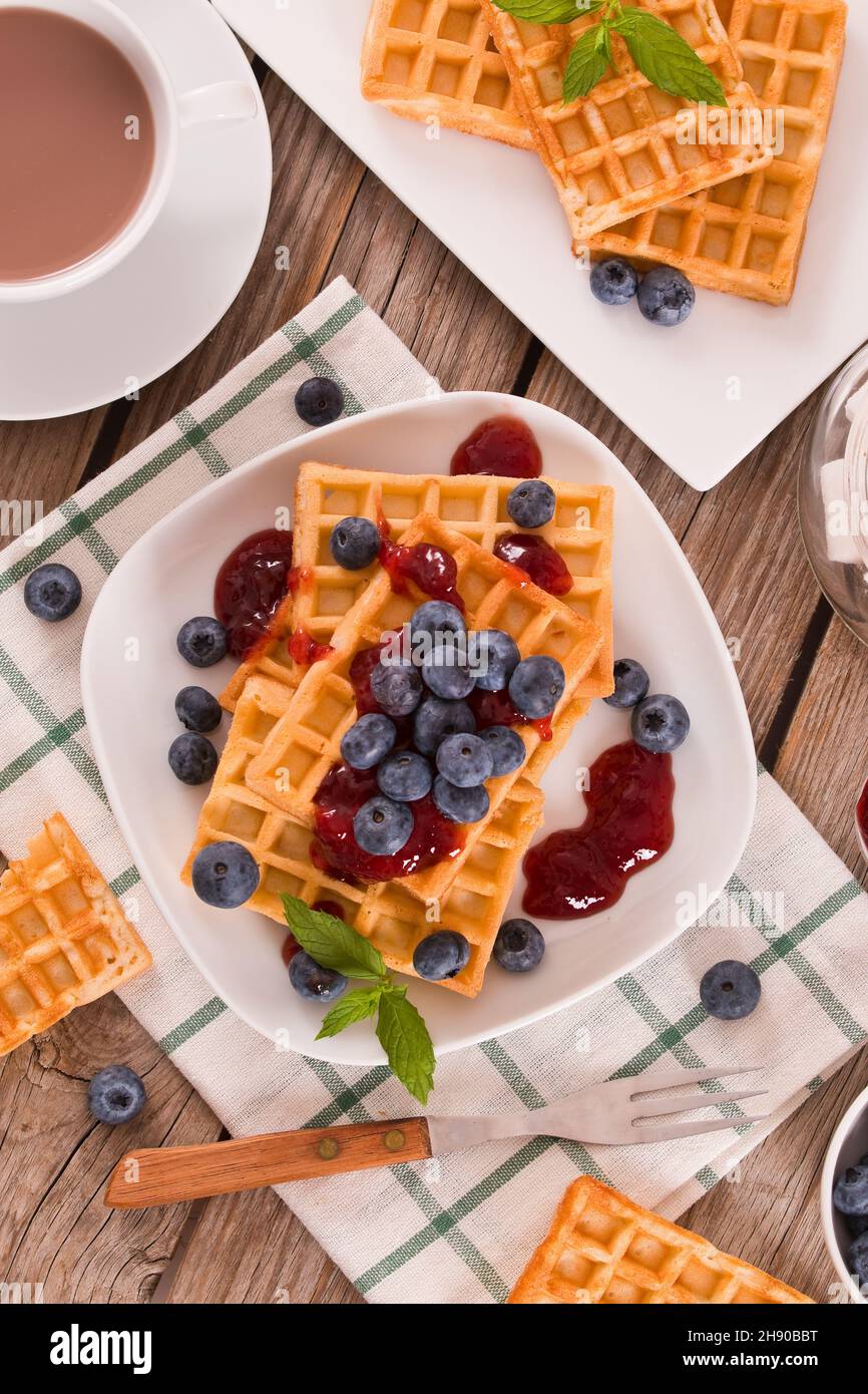 Waffles with blueberries and jam Stock Photo - Alamy