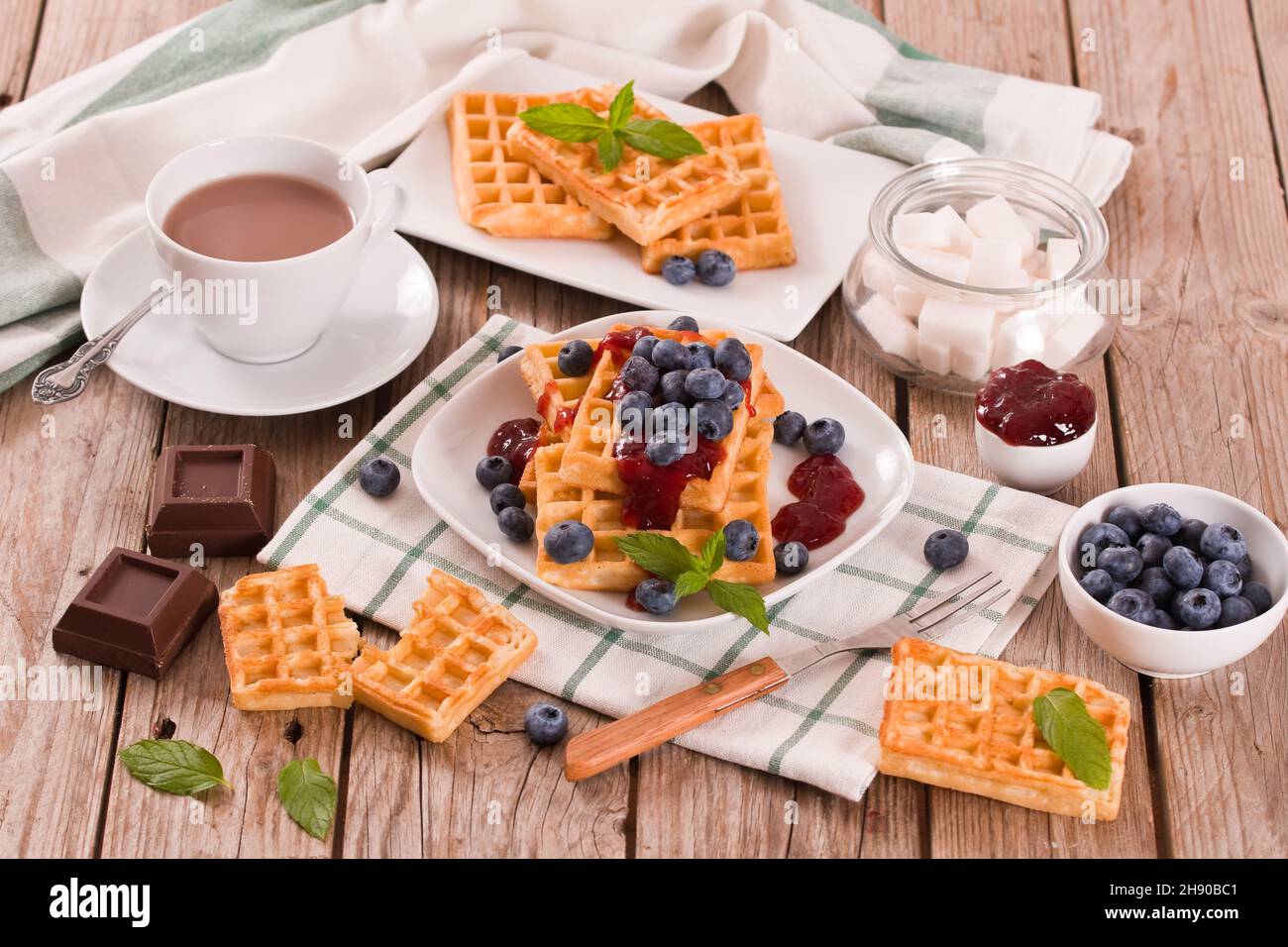 Waffles with blueberries and jam Stock Photo - Alamy