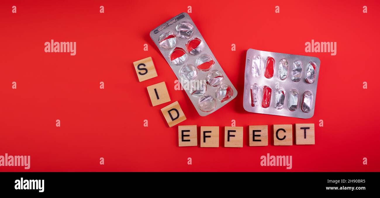 Words side effect on colored red paper texture background. Concept ...