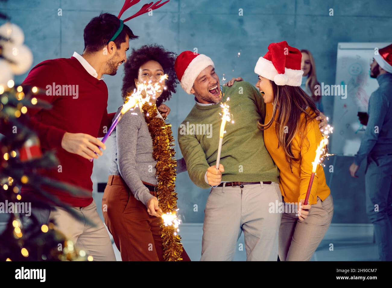 New Year's eve celebration. A group of multicultural colleagues ...