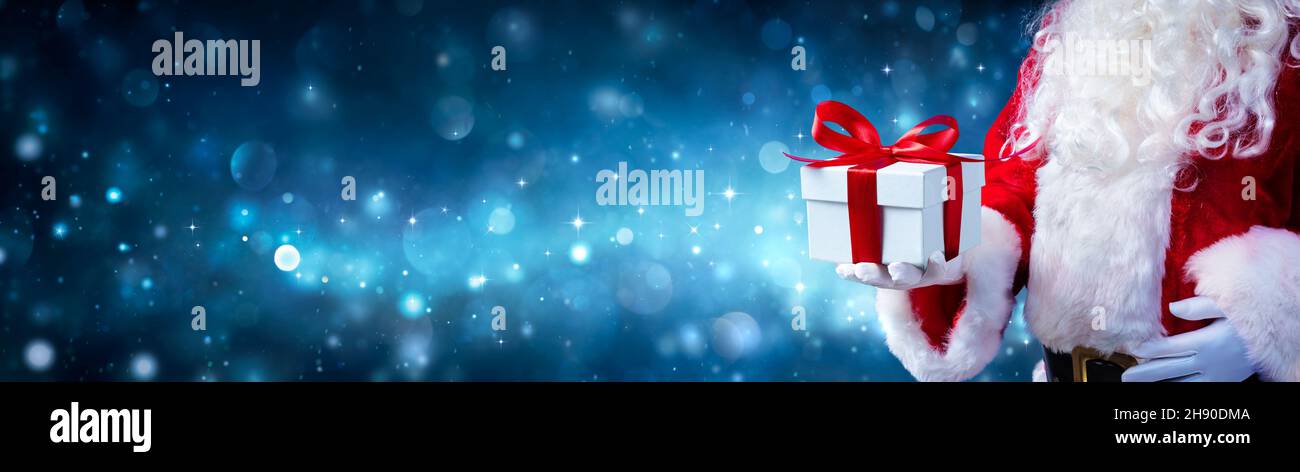 Christmas Present Santa Claus Give Gift With Abstract Lights At Night ...