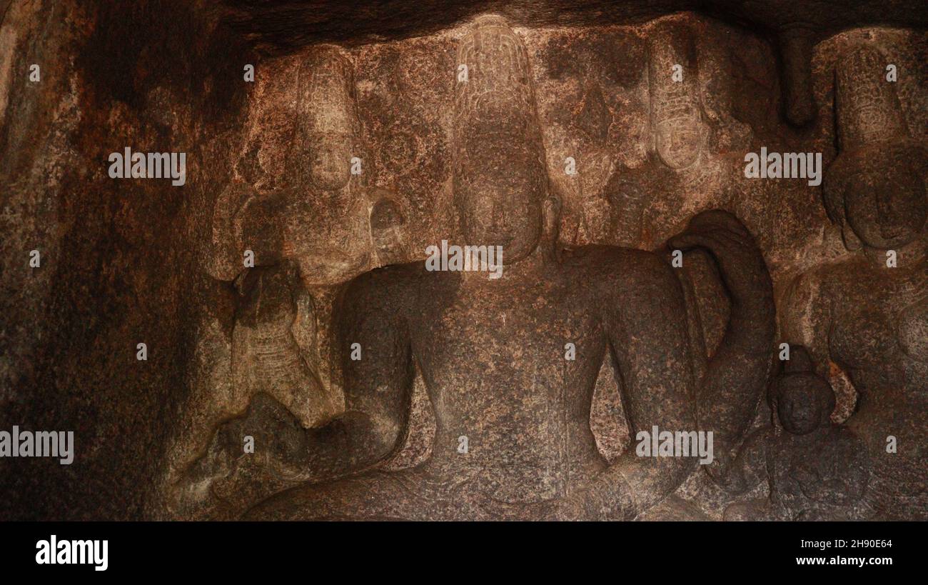 Beautiful stone carved patterns in the cave temple. The rock is located ...