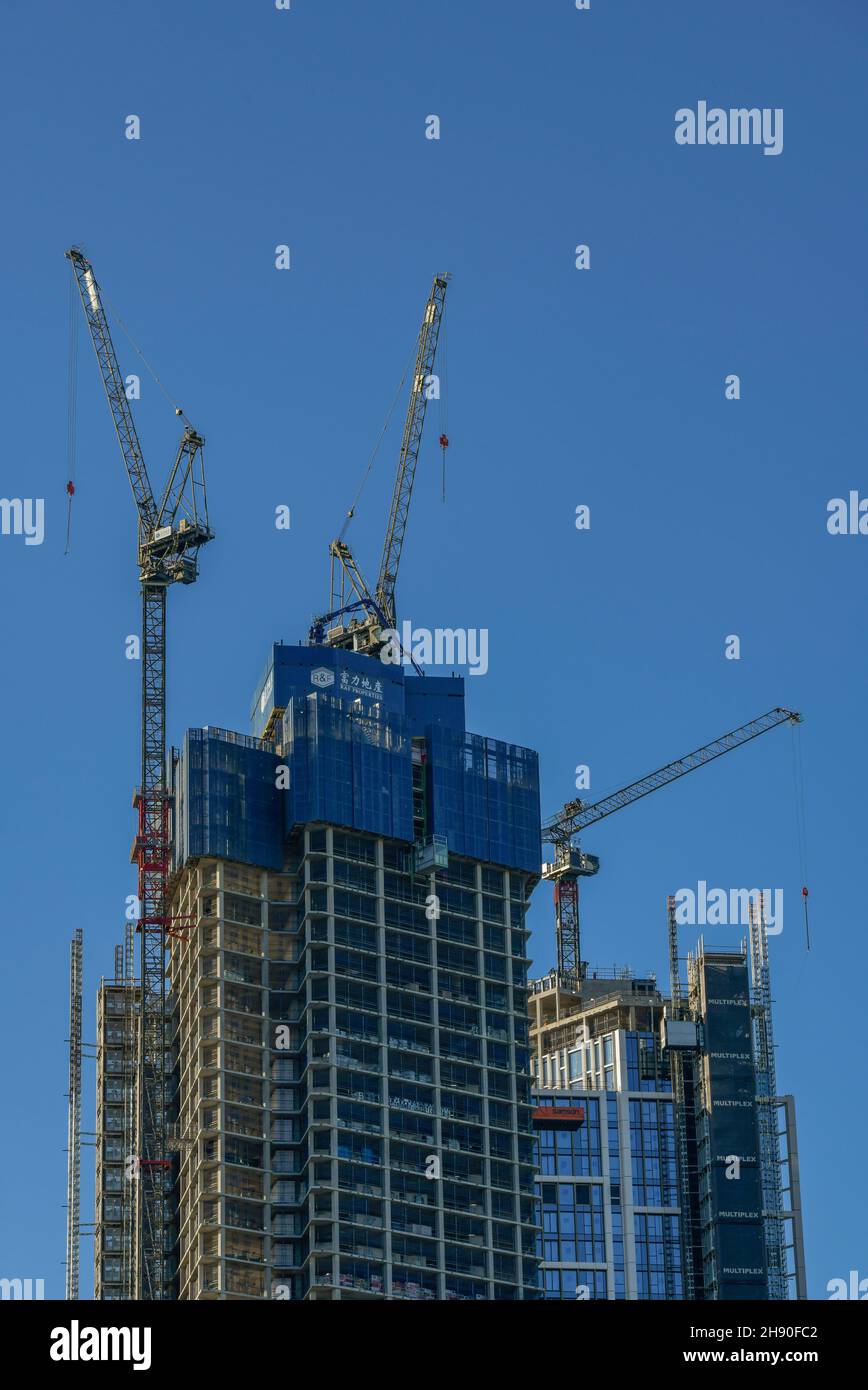 large tower cranes on a construction site in central london builing a ...