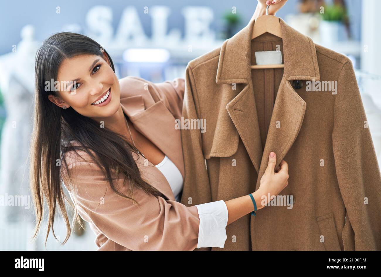 Young nice girl in store during shopping Stock Photo - Alamy