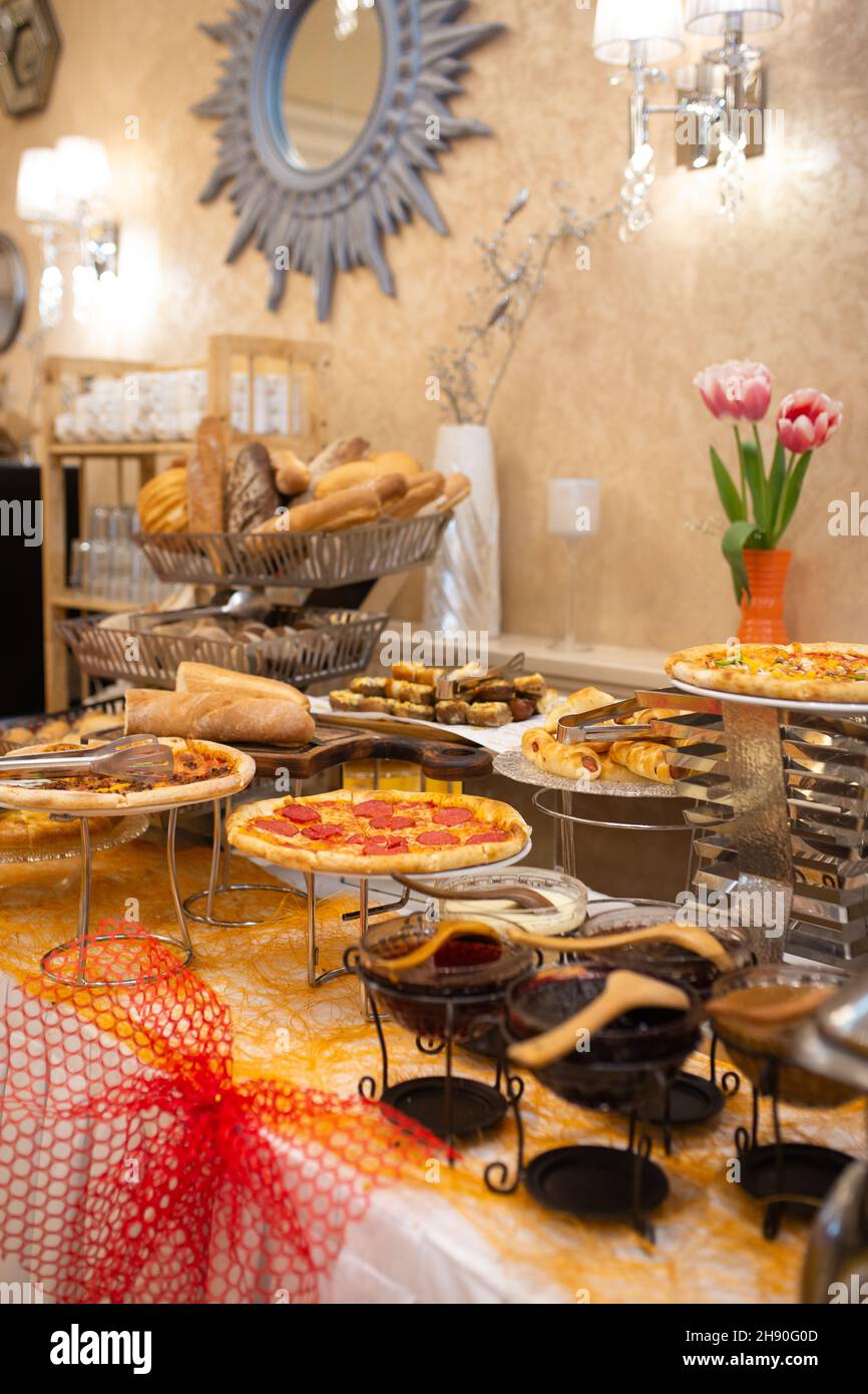 fresh pizzas on the buffet in the restaurant Stock Photo - Alamy
