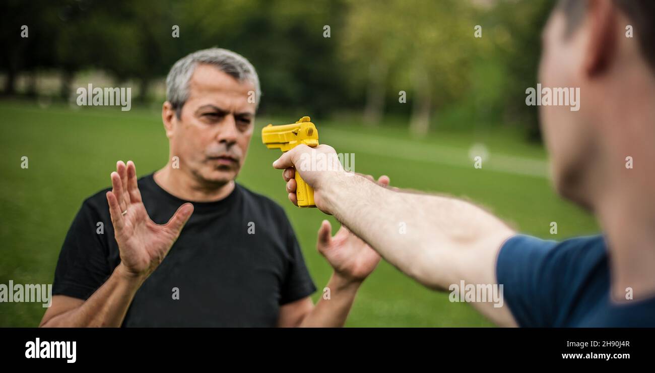 Kapap instructor demonstrates self defense techniques against a gun ...