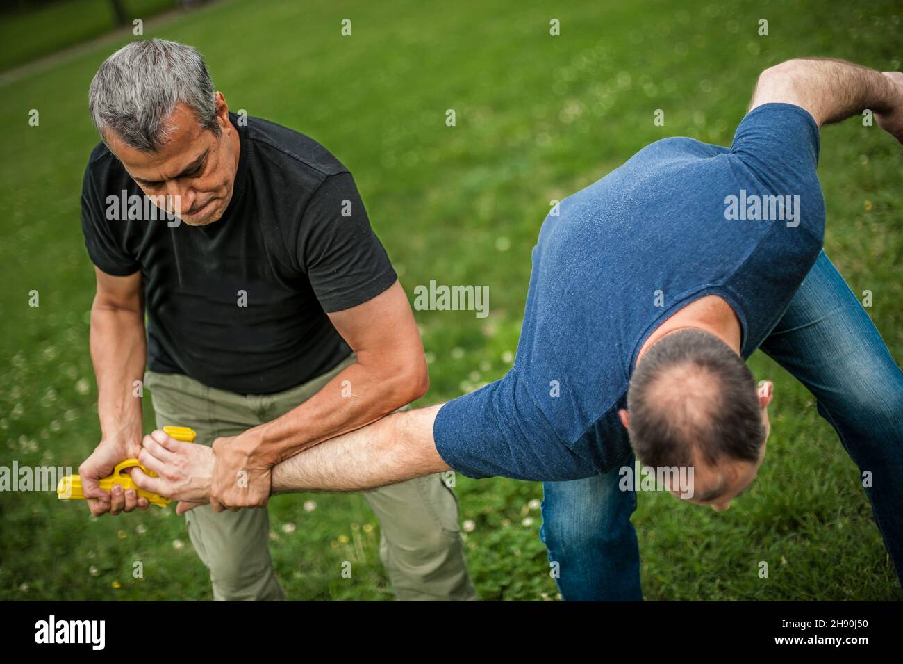 Kapap instructor demonstrates self defense techniques against a gun ...