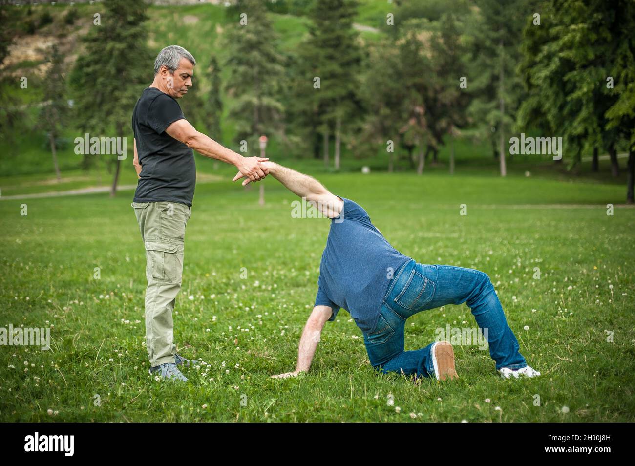 Kapap instructor demonstrates self defense techniques against a gun ...