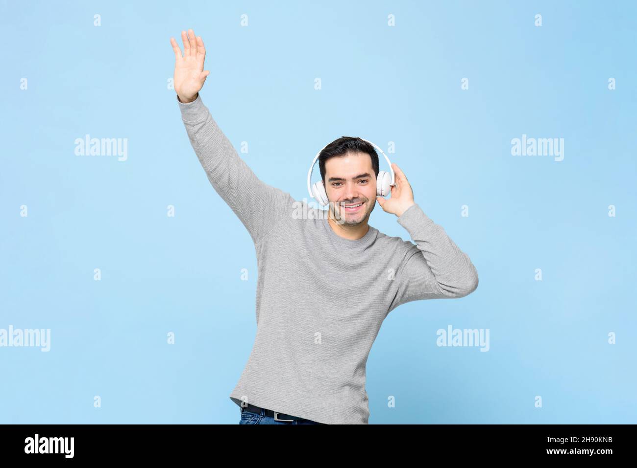 Smiling man raising hand hi-res stock photography and images - Alamy