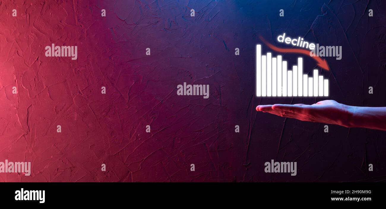 Business man holding holographic graphs and stock.Decline, decrease, down, drop. Business ...