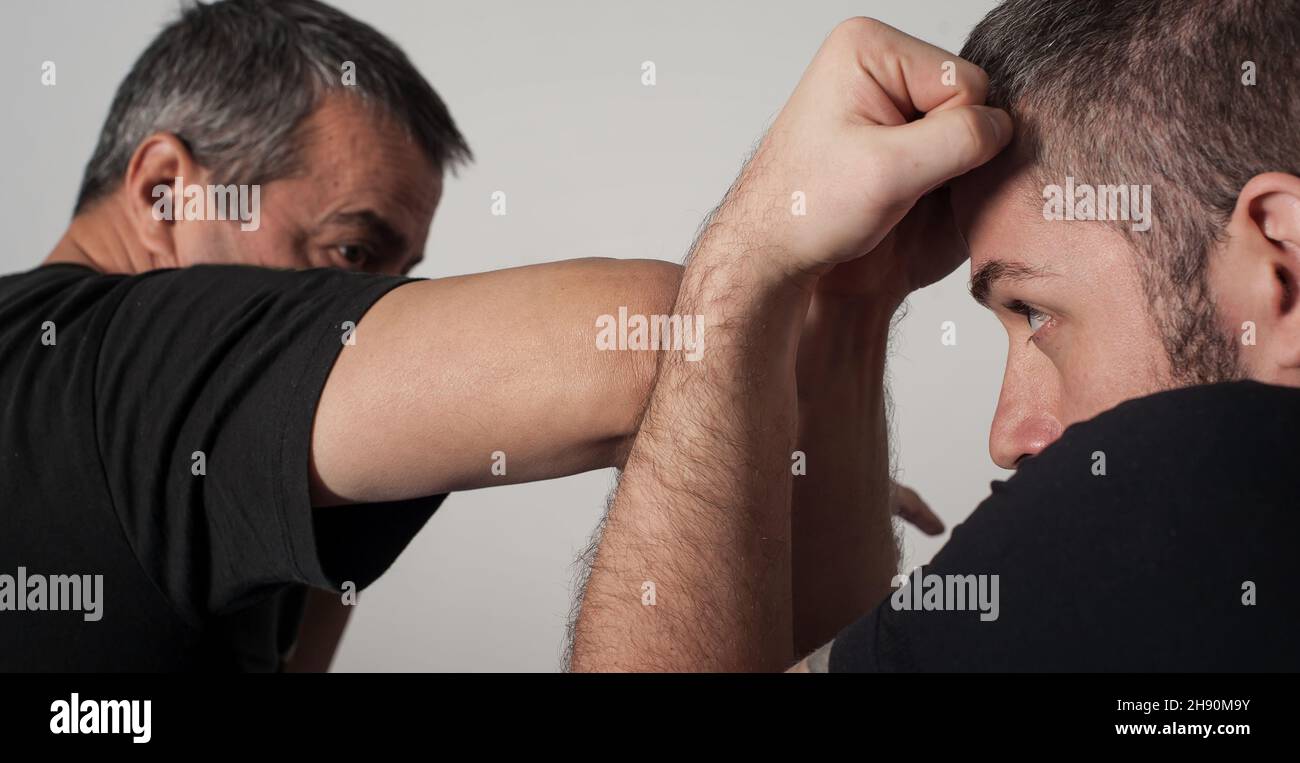 Kapap instructor demonstrates fighting techniques with his student ...