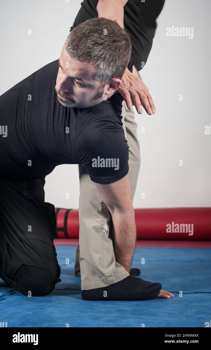 Kapap instructor demonstrates standing arm lock techniques with his ...