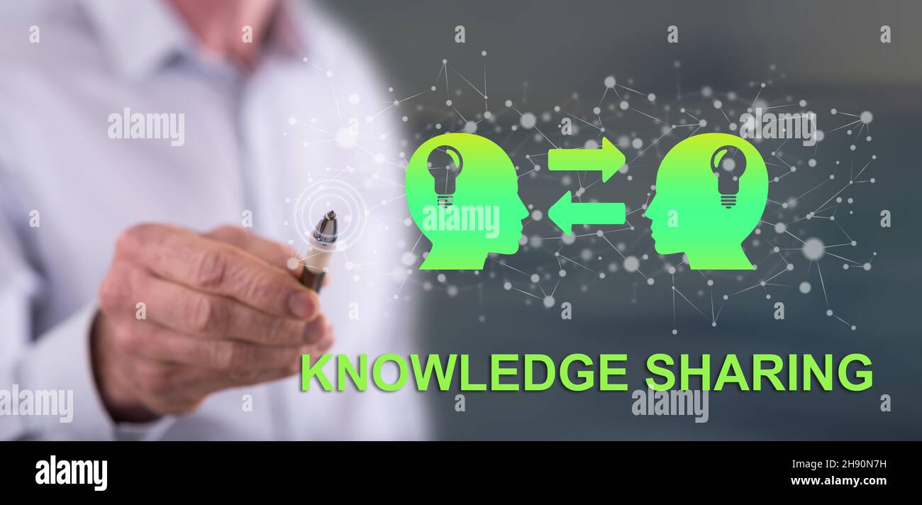 Man touching a knowledge sharing concept on a touch screen with a pen ...