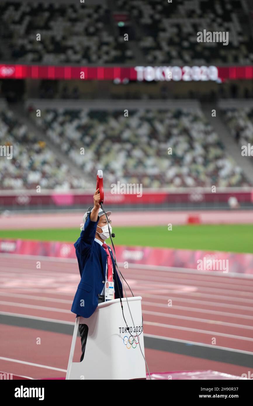 Athletics judge starting with the pistol at the Tokyo 2020 Olympic ...