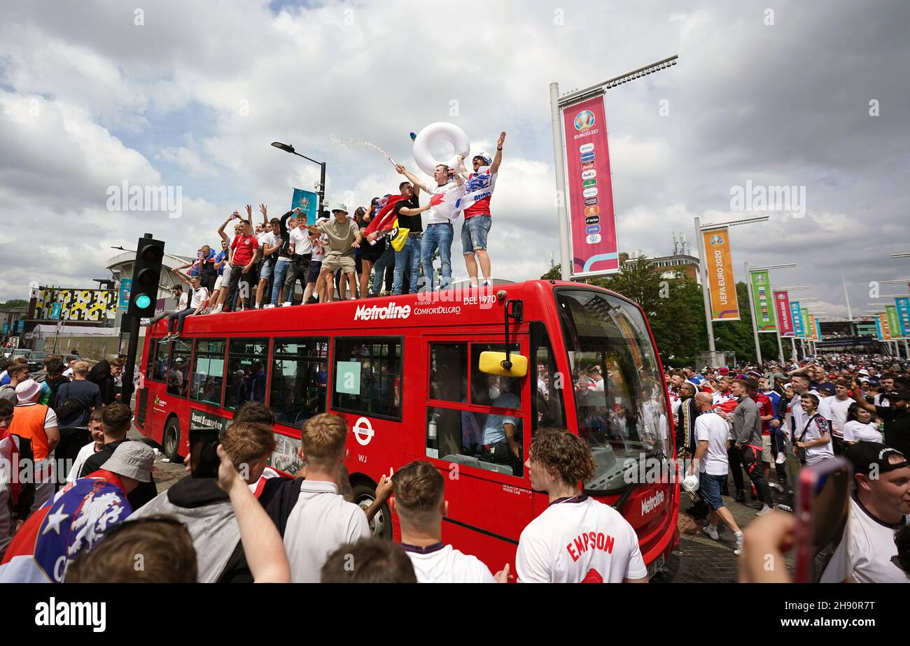 File photo dated 11-07-2021 of England fans climb aboard a bus outside ...