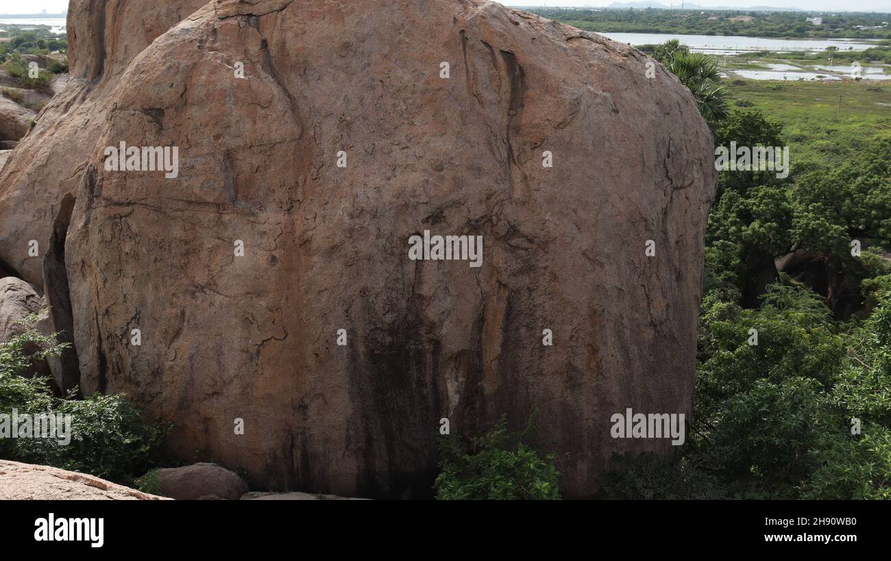 The large rock is located in the natural background Stock Photo - Alamy