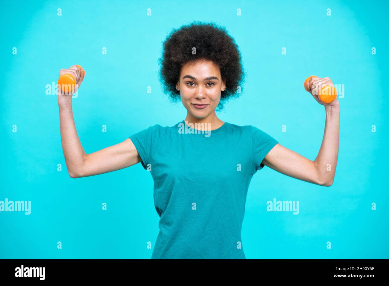 beautiful young woman making sport at the gym. female model posing for ...