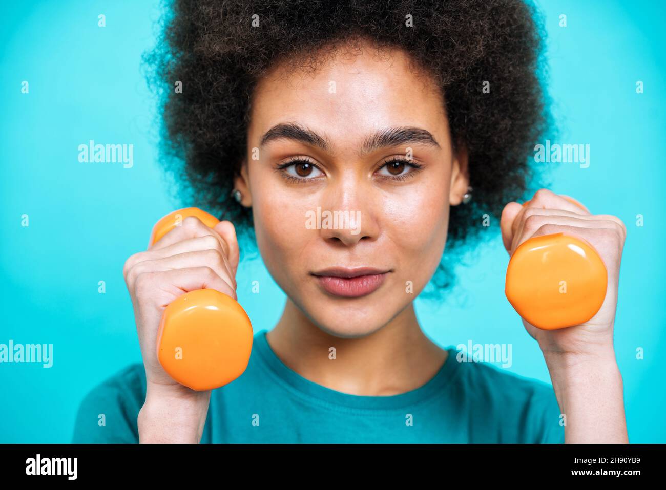beautiful young woman making sport at the gym. female model posing for ...