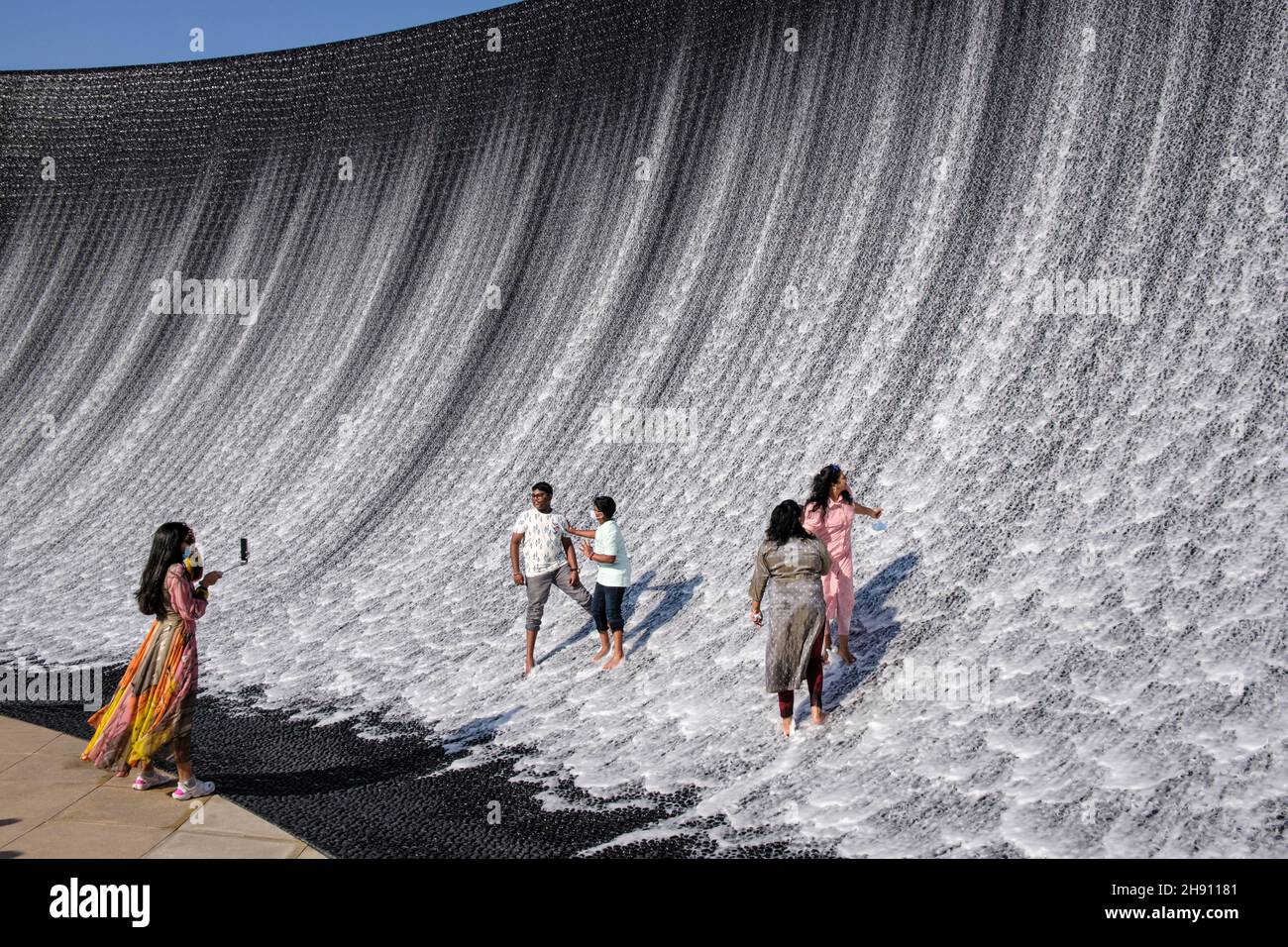 Visitors enjoying the unique water feature at Expo 2020, Dubai Stock ...