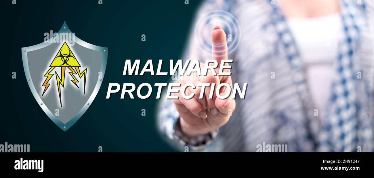 Woman touching a malware protection concept on a touch screen with her ...
