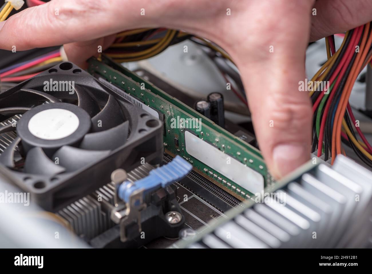 Hands installing ram memory Stock Photo - Alamy
