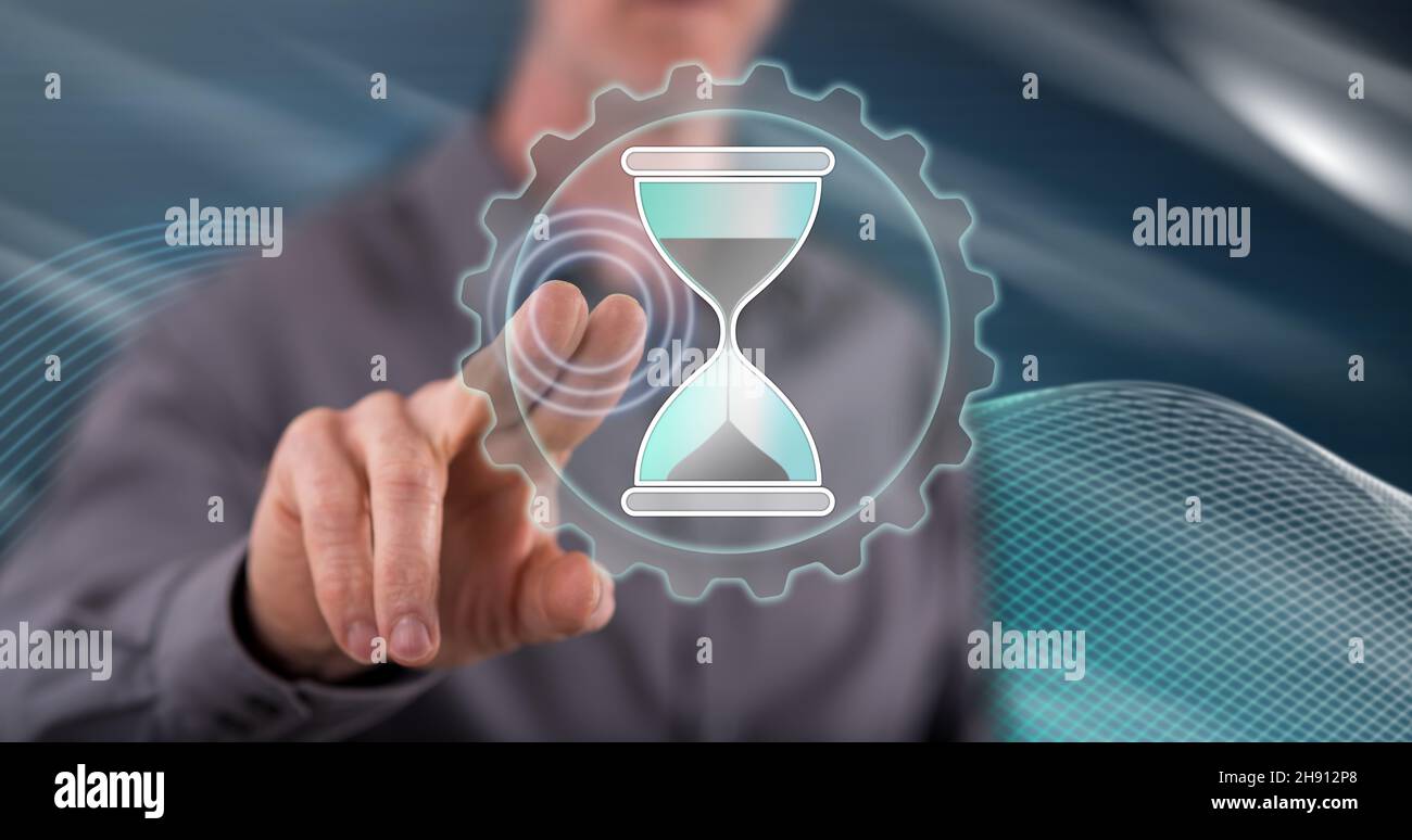 Man touching a time management concept on a touch screen with his ...