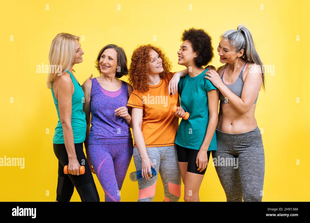 Group of women with different body, age, and ethnicity making sport ...