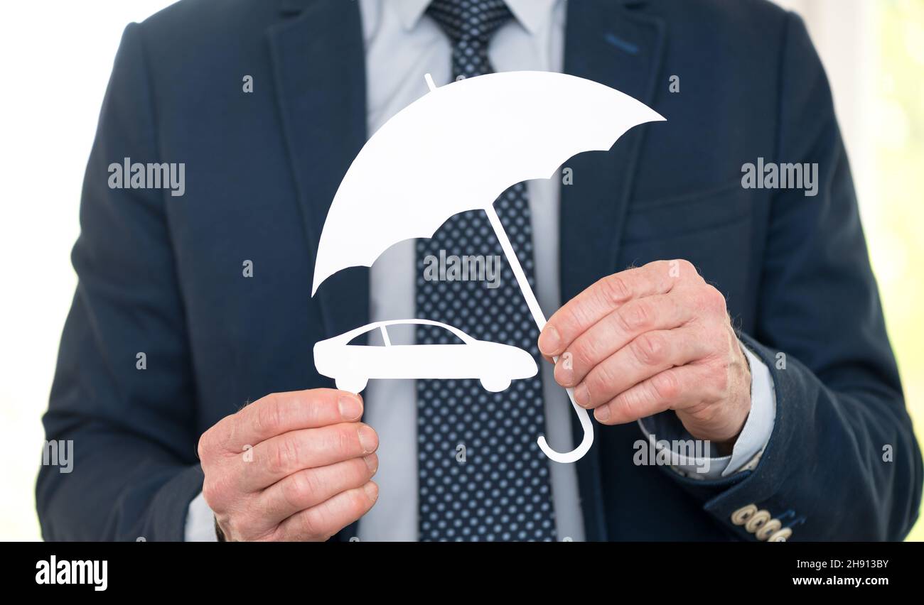 Symbol of car coverage by a general agent Stock Photo - Alamy