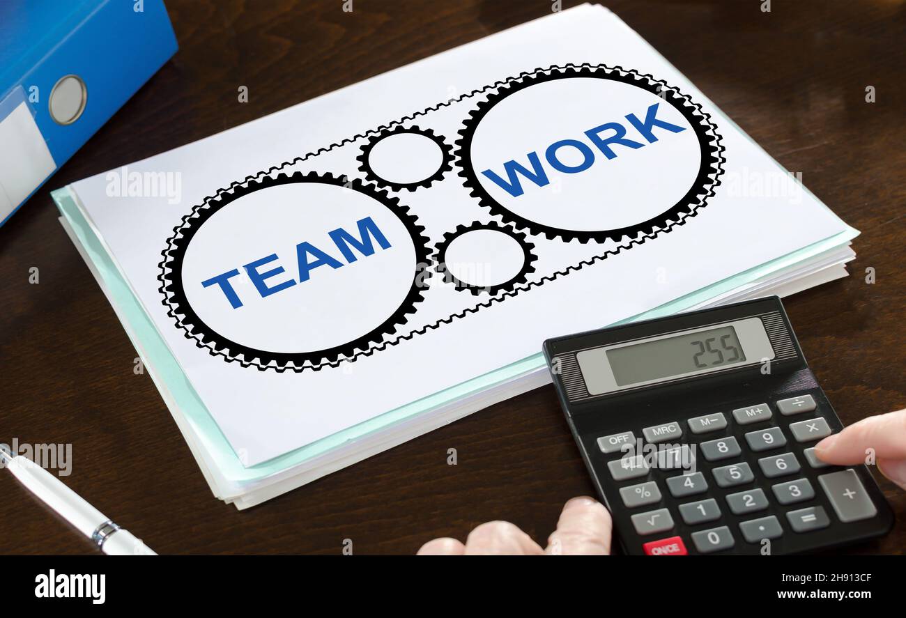 Teamwork concept illustrated on a paper with a calculator Stock Photo ...