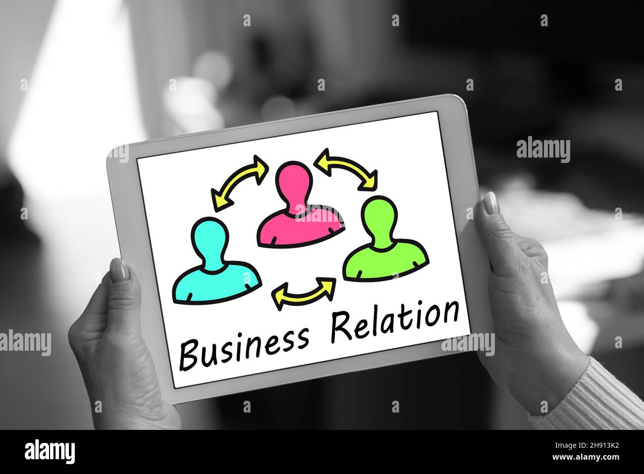 Business relation concept shown on a tablet held by a woman Stock Photo ...