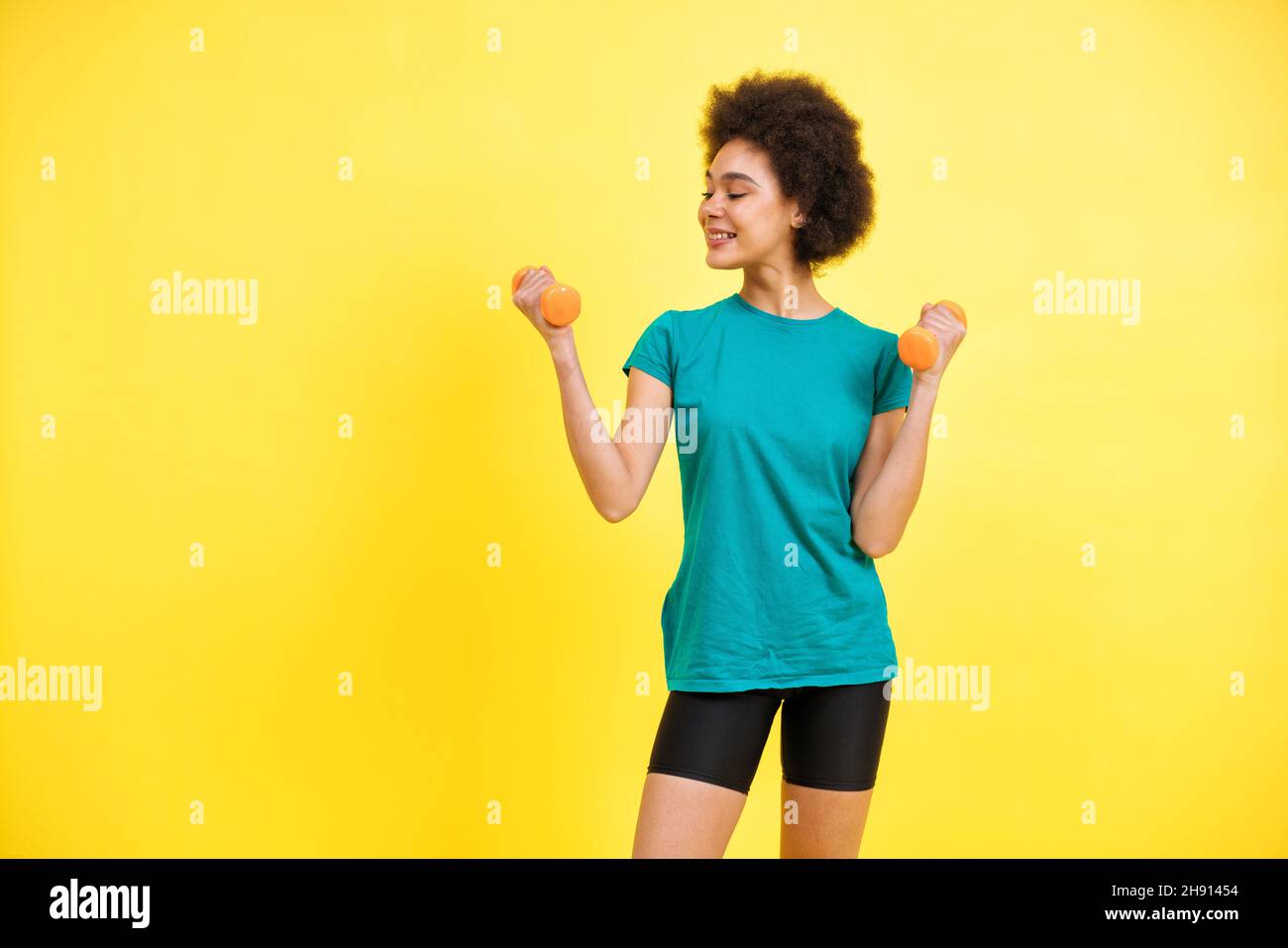 beautiful young woman making sport at the gym. female model posing for ...