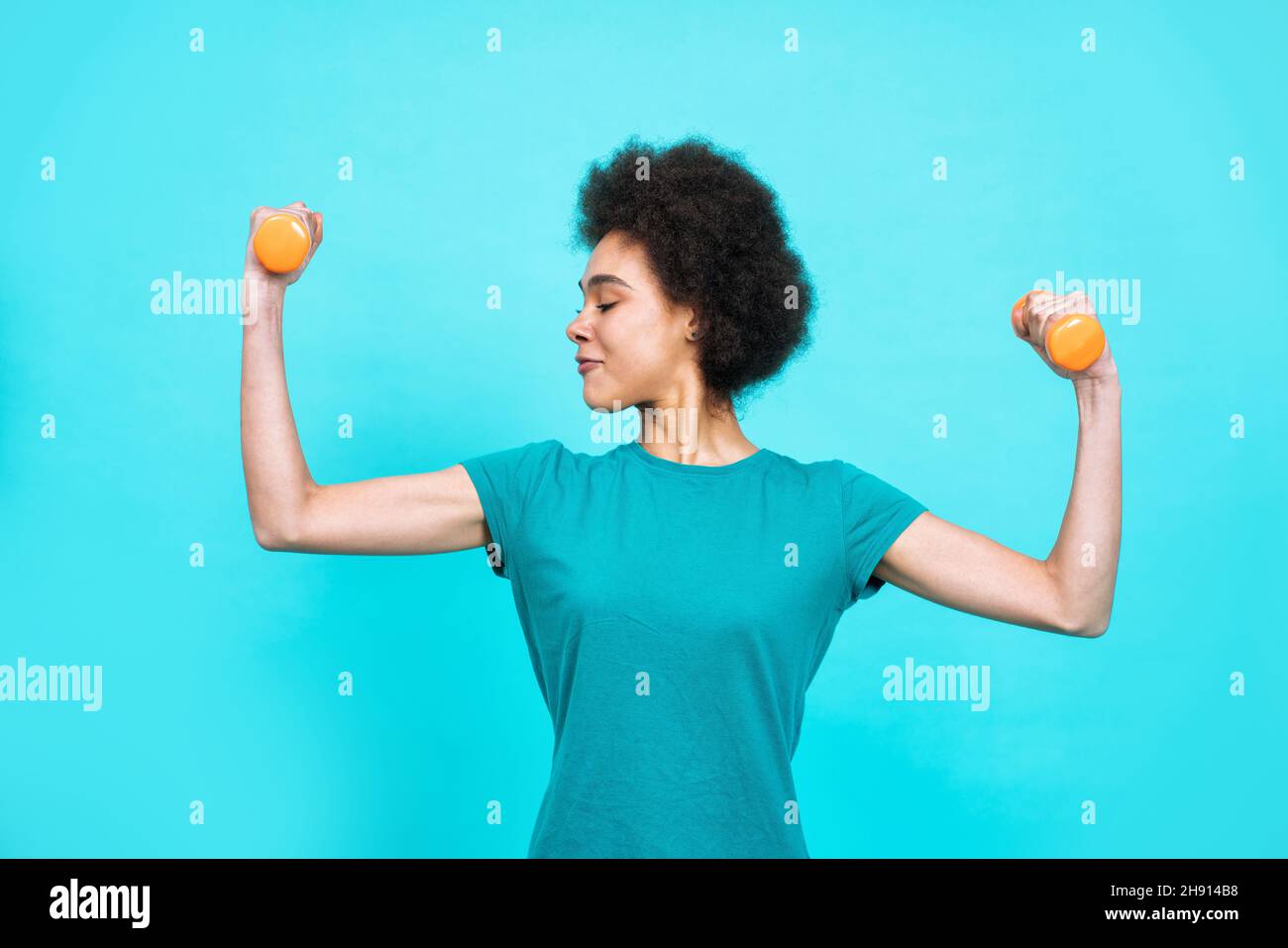 beautiful young woman making sport at the gym. female model posing for ...