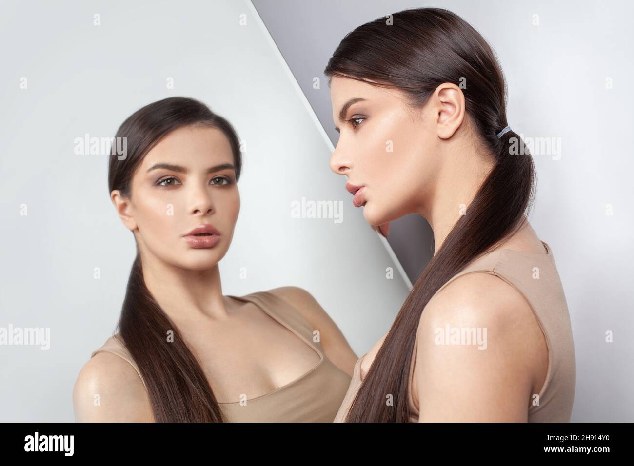 Sad thinking woman and self-image mirror on white background. Stress ...