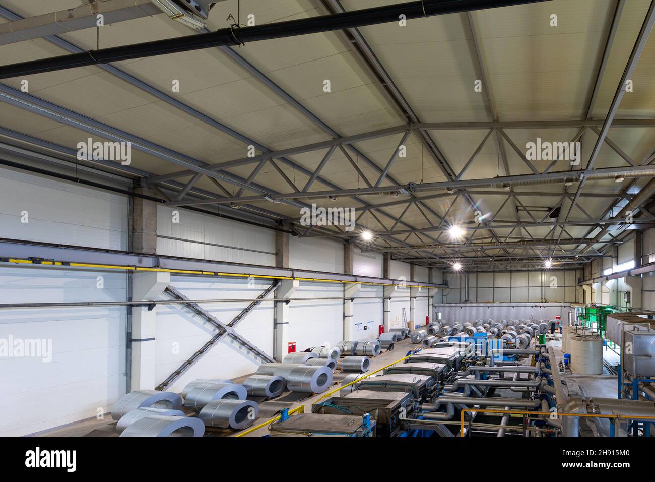 Photo of production line of metal tile for roof. Steel forming machine ...