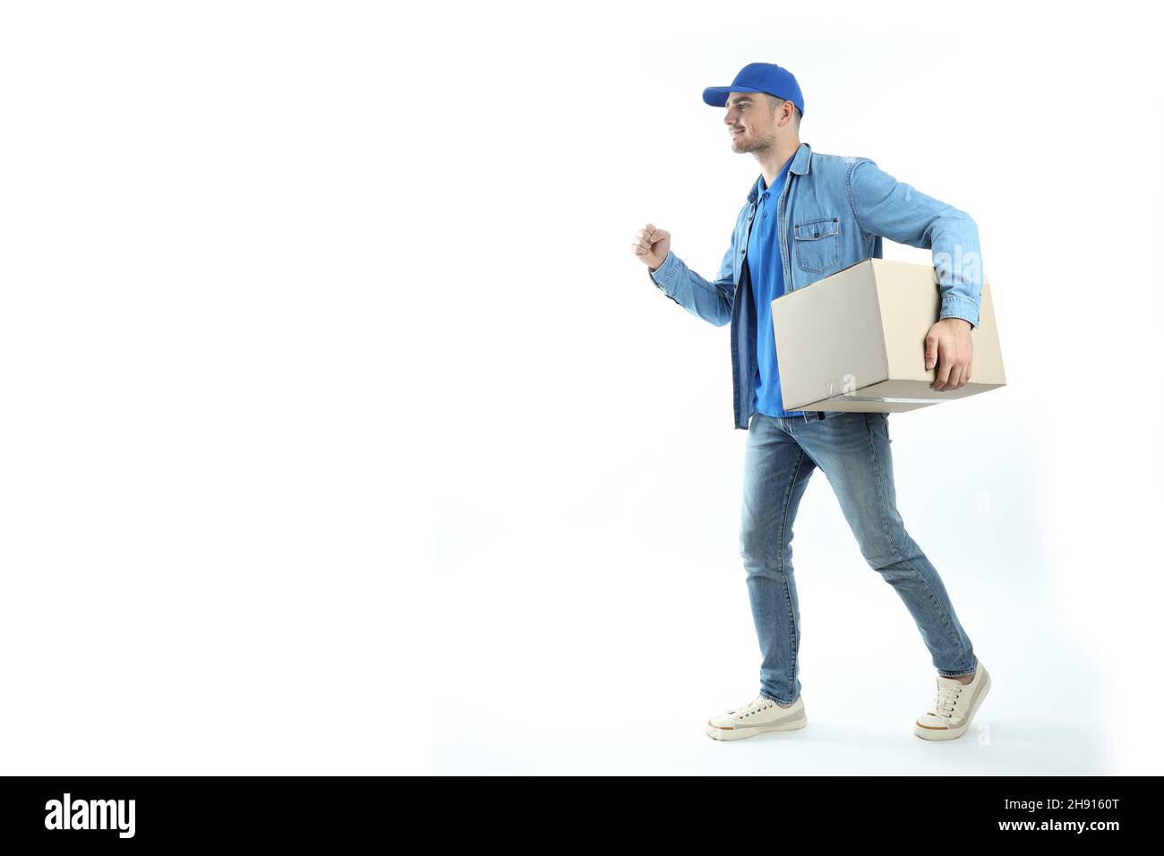 Delivery man walking with a box, isolated on white background Stock ...