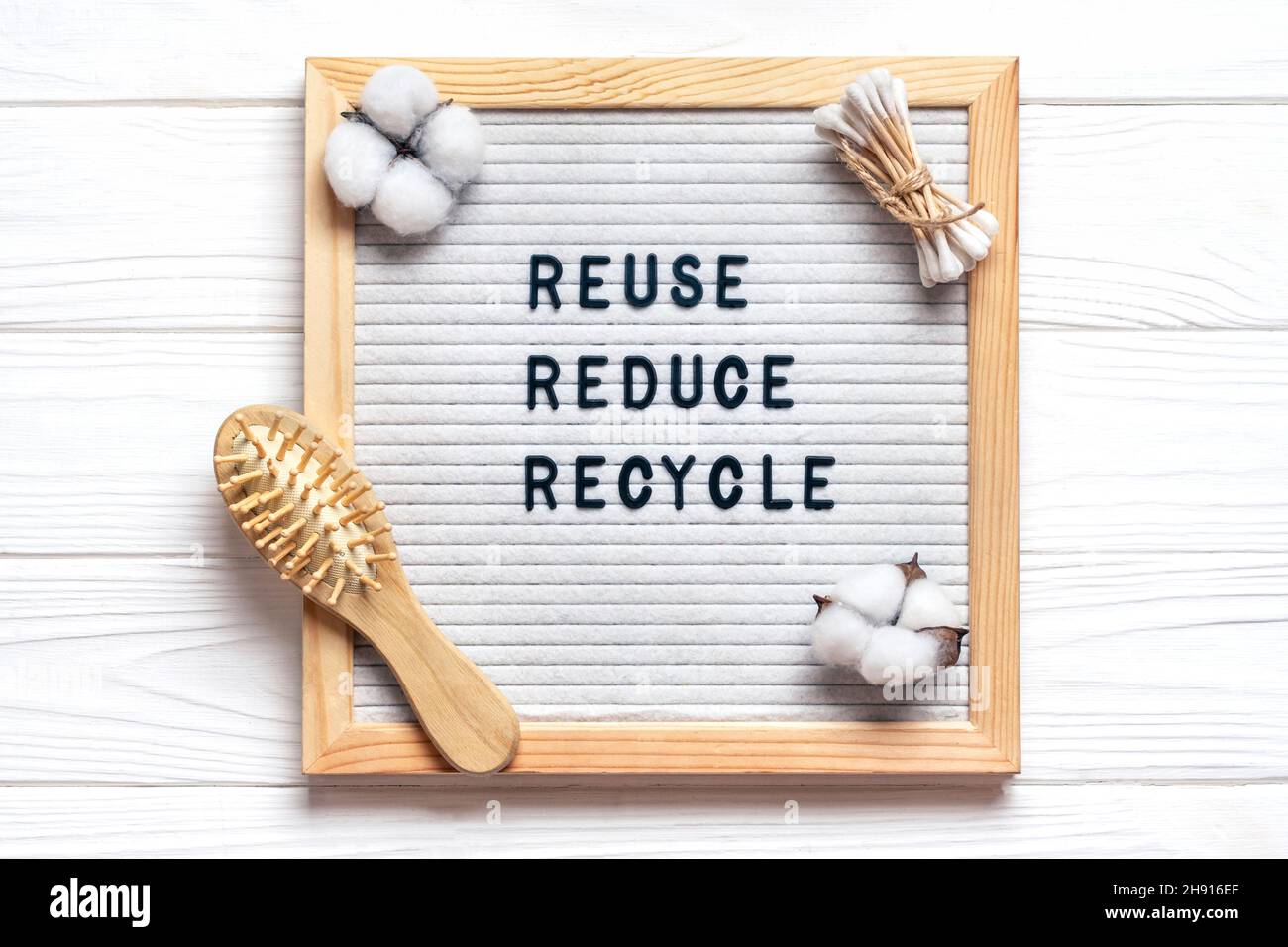 Felt board with quote text Reuse, Reduce, Recycle on white wooden table ...