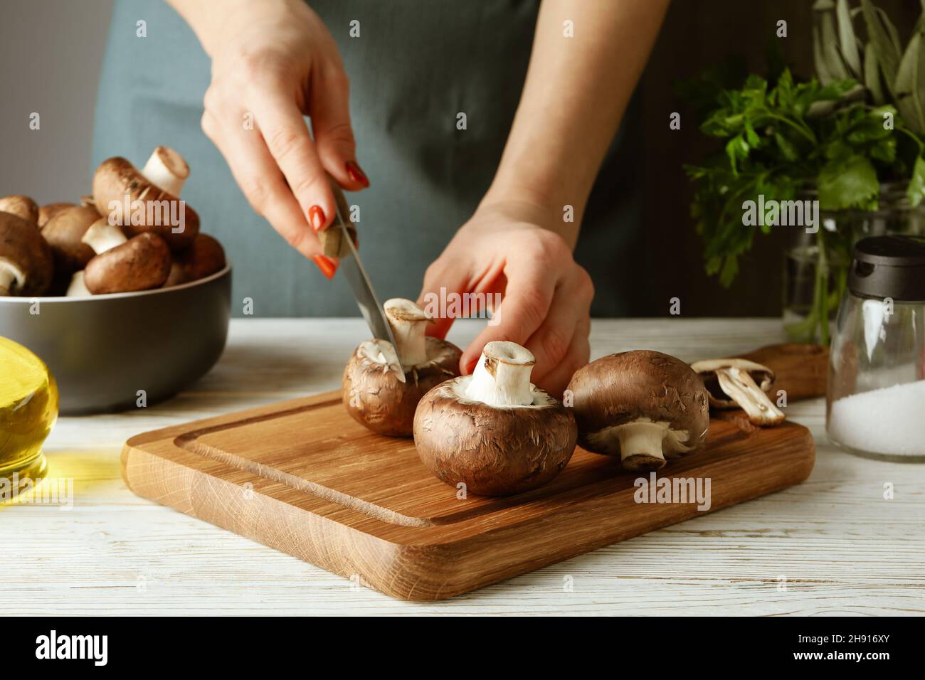 Concept of cooking with champignon on white wooden table Stock Photo ...