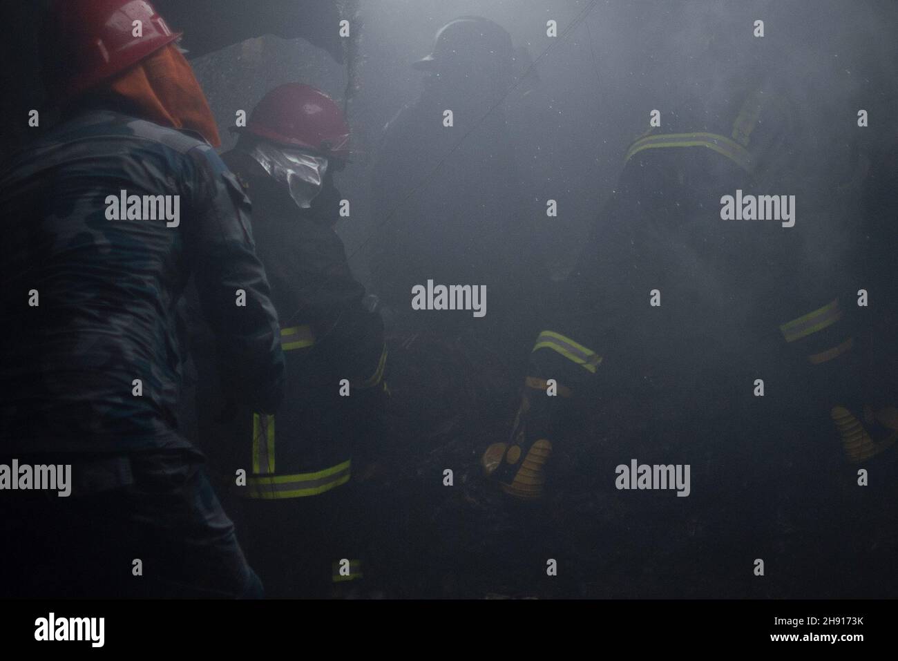 Kathmandu, Nepal. 3rd Dec, 2021. Firefighters with the help of the ...