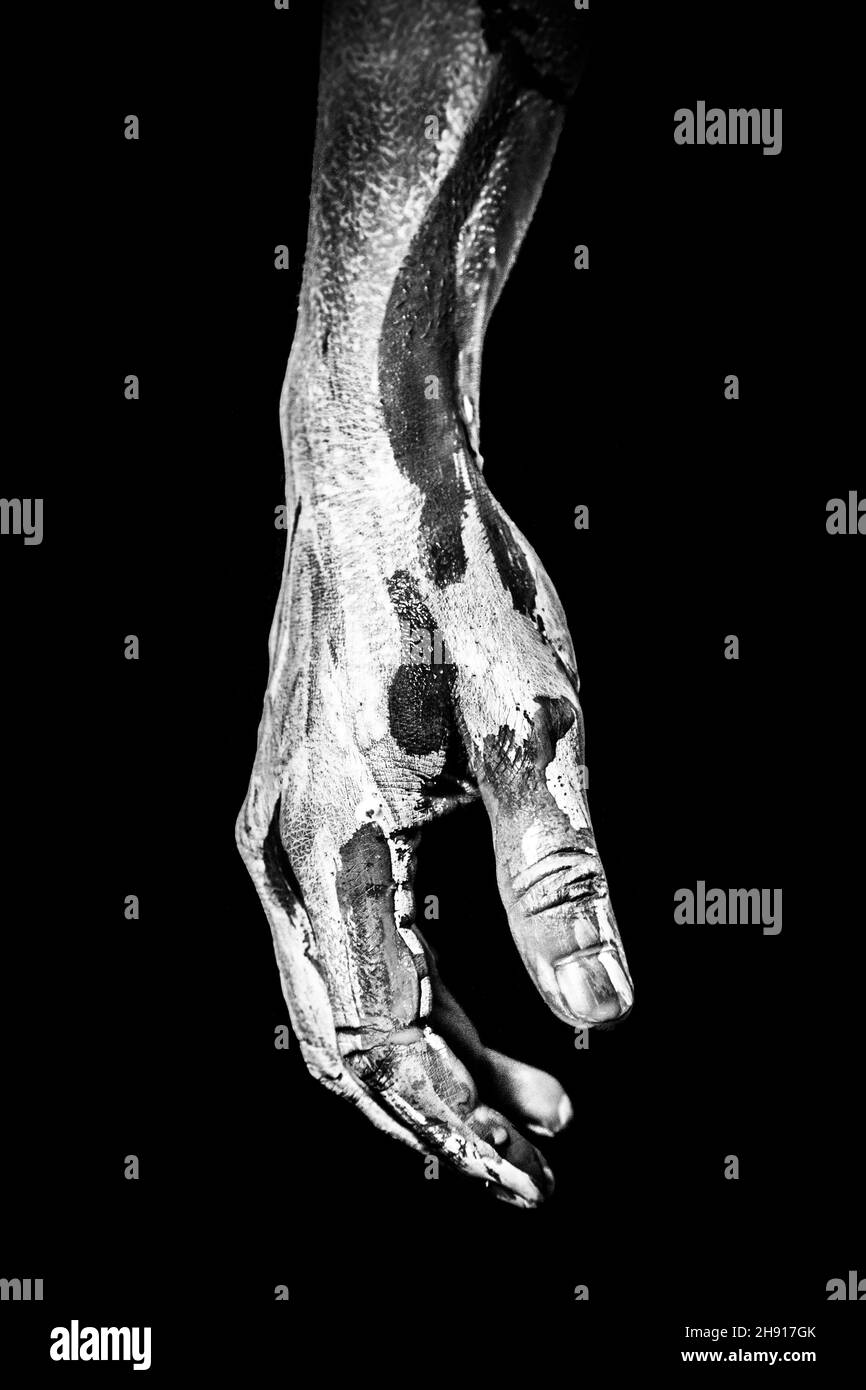 Black painted hand arm hi-res stock photography and images - Alamy