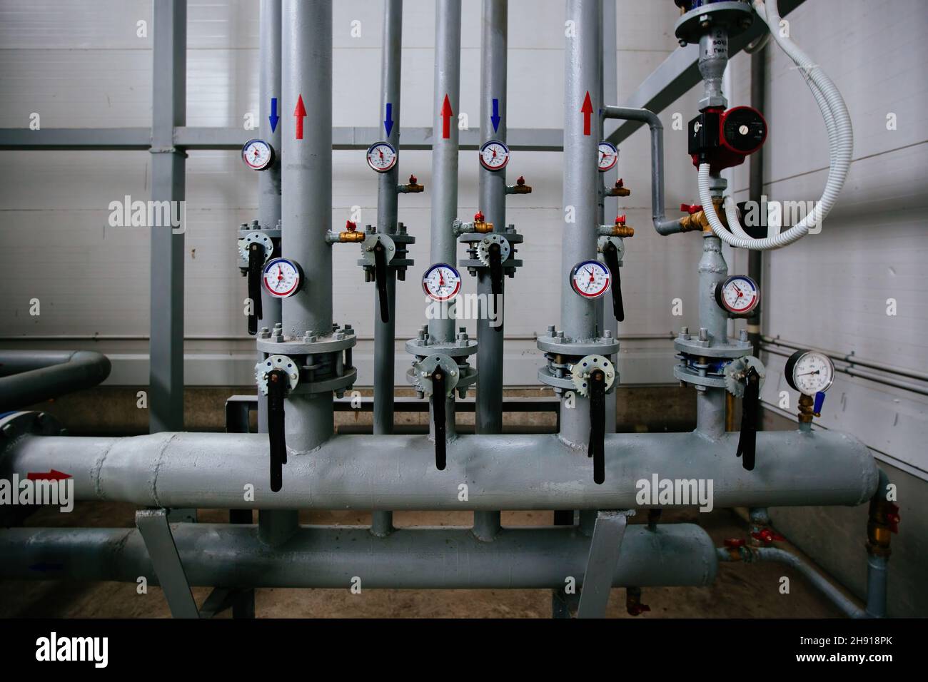 Steel pipeline of heating or plumbing system with manometers Stock ...